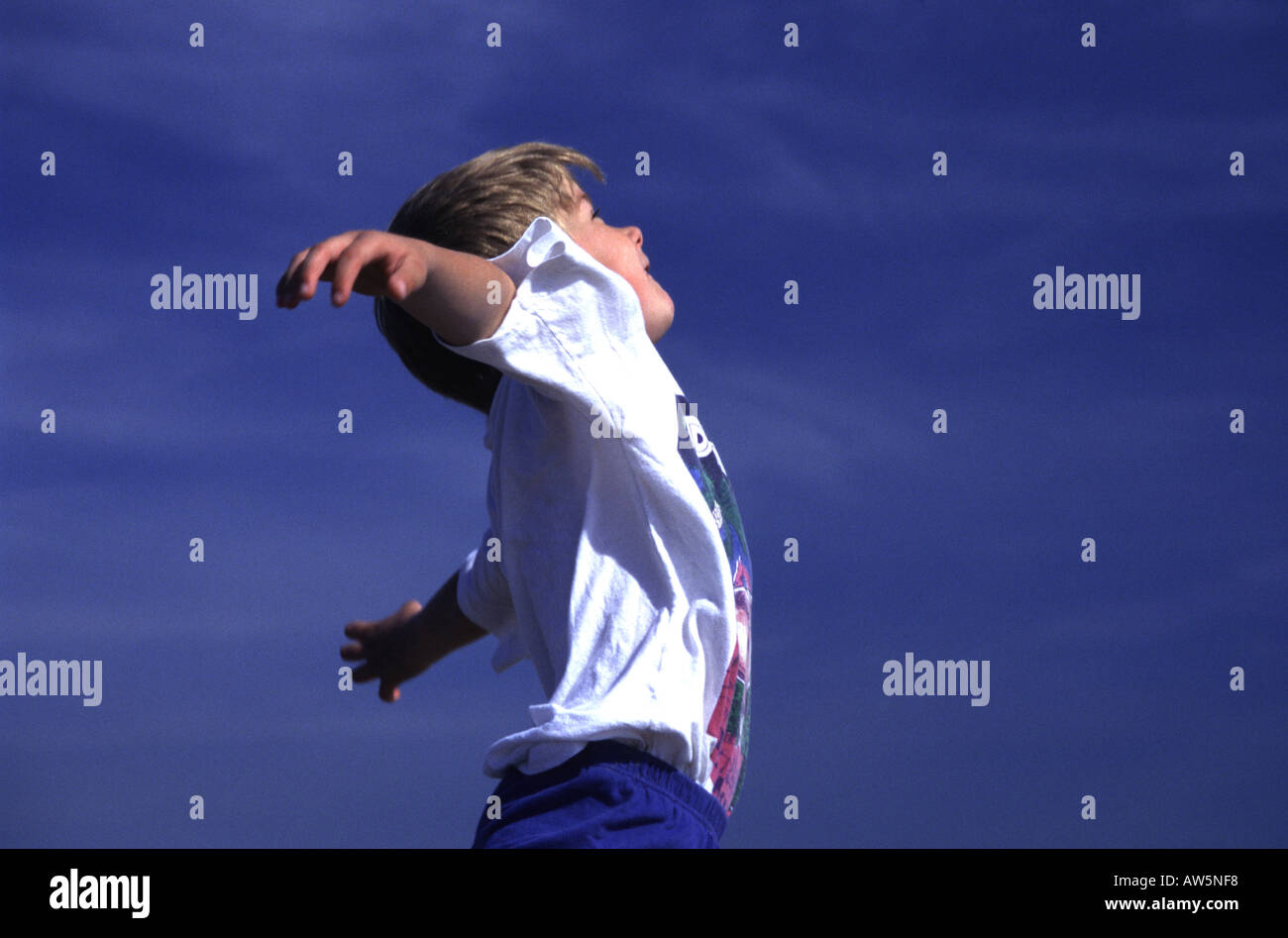 Teen boy arms outstretched hi-res stock photography and images - Alamy