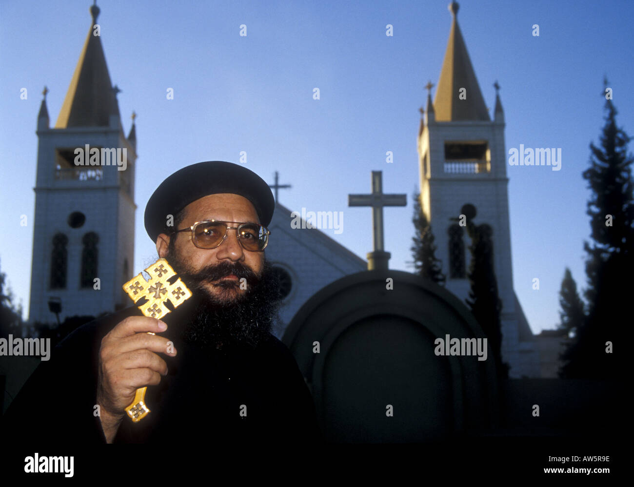 Coptic Christian priest with cross, outside St Marks Church in Assiut ...