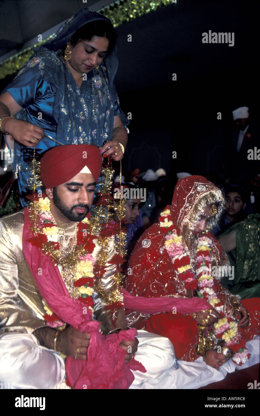Sikh wedding nuptials with bride and groom, marriage in a British ...