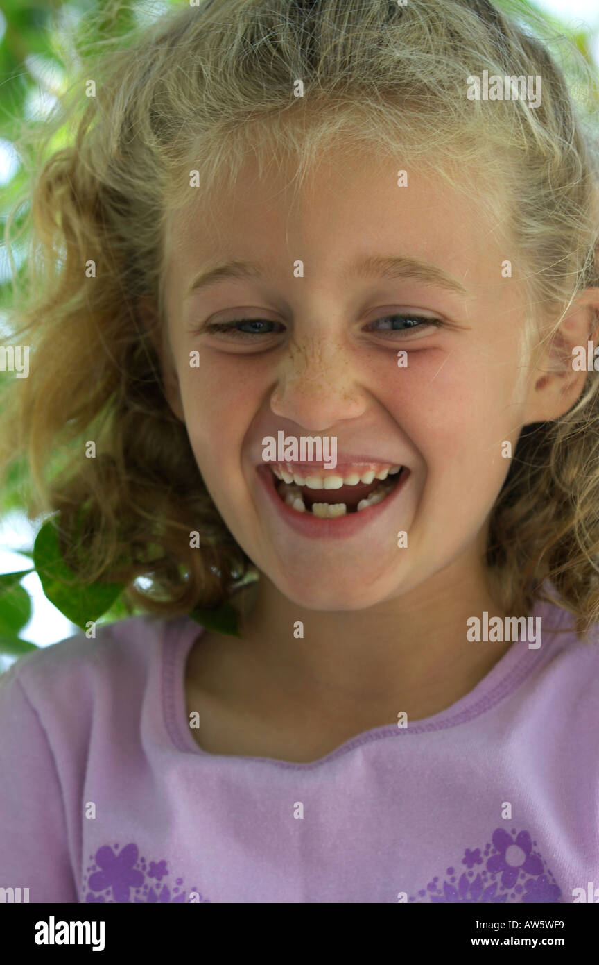 laughing girl with missing teeth Stock Photo - Alamy