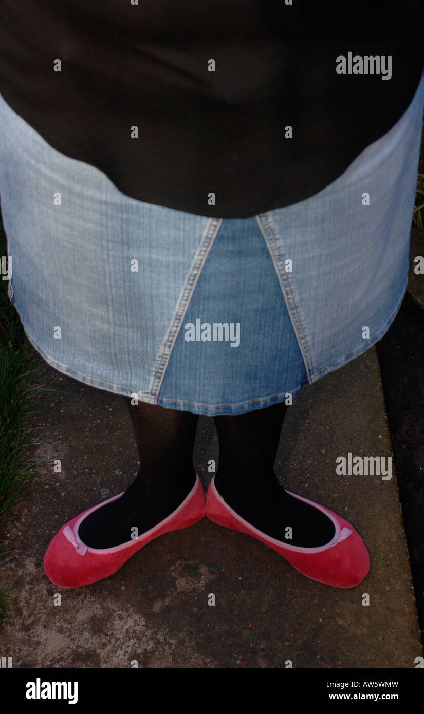 Woman wearing pink slippers hi-res stock photography and images - Alamy
