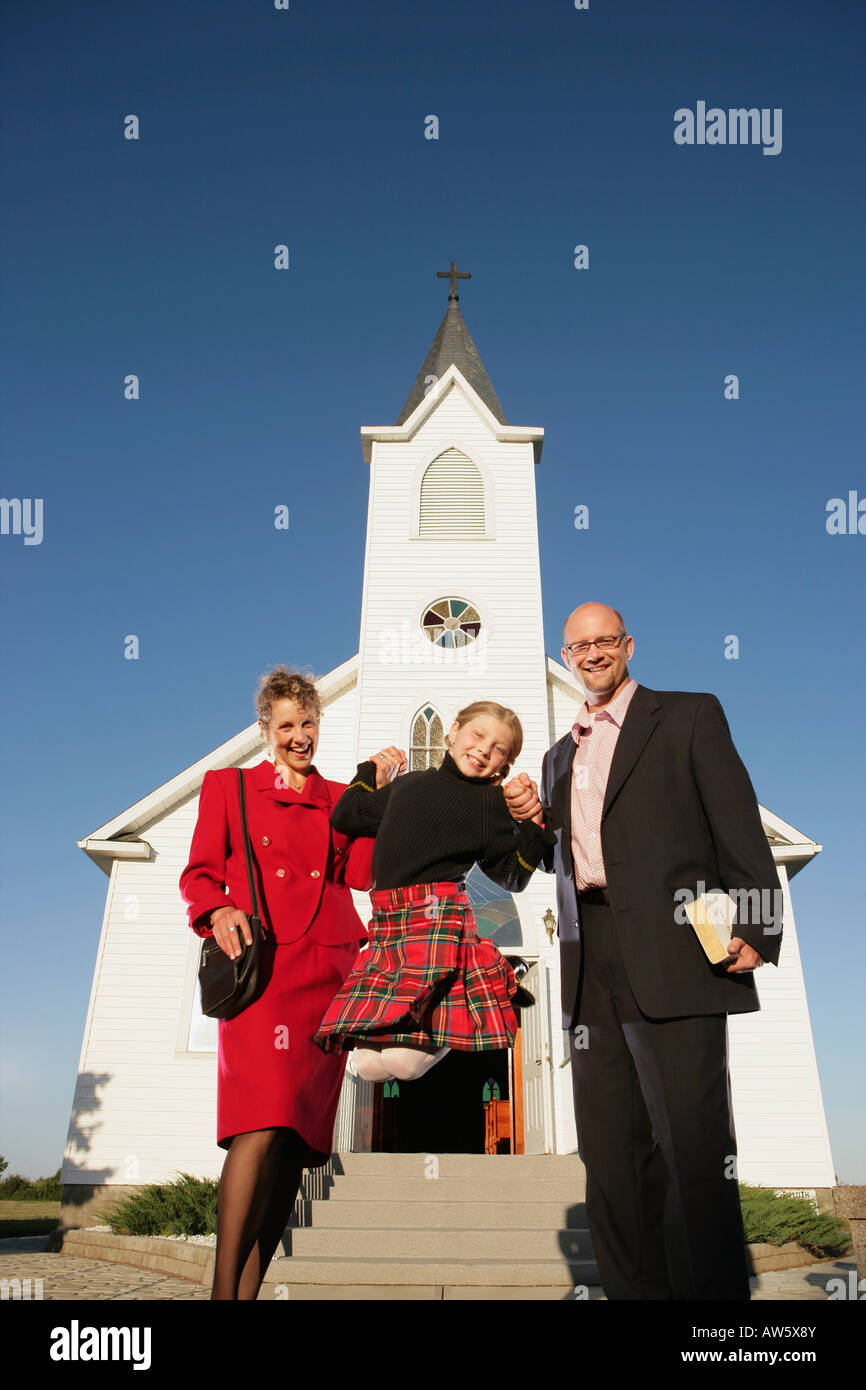 A family coming home from church Stock Photo - Alamy