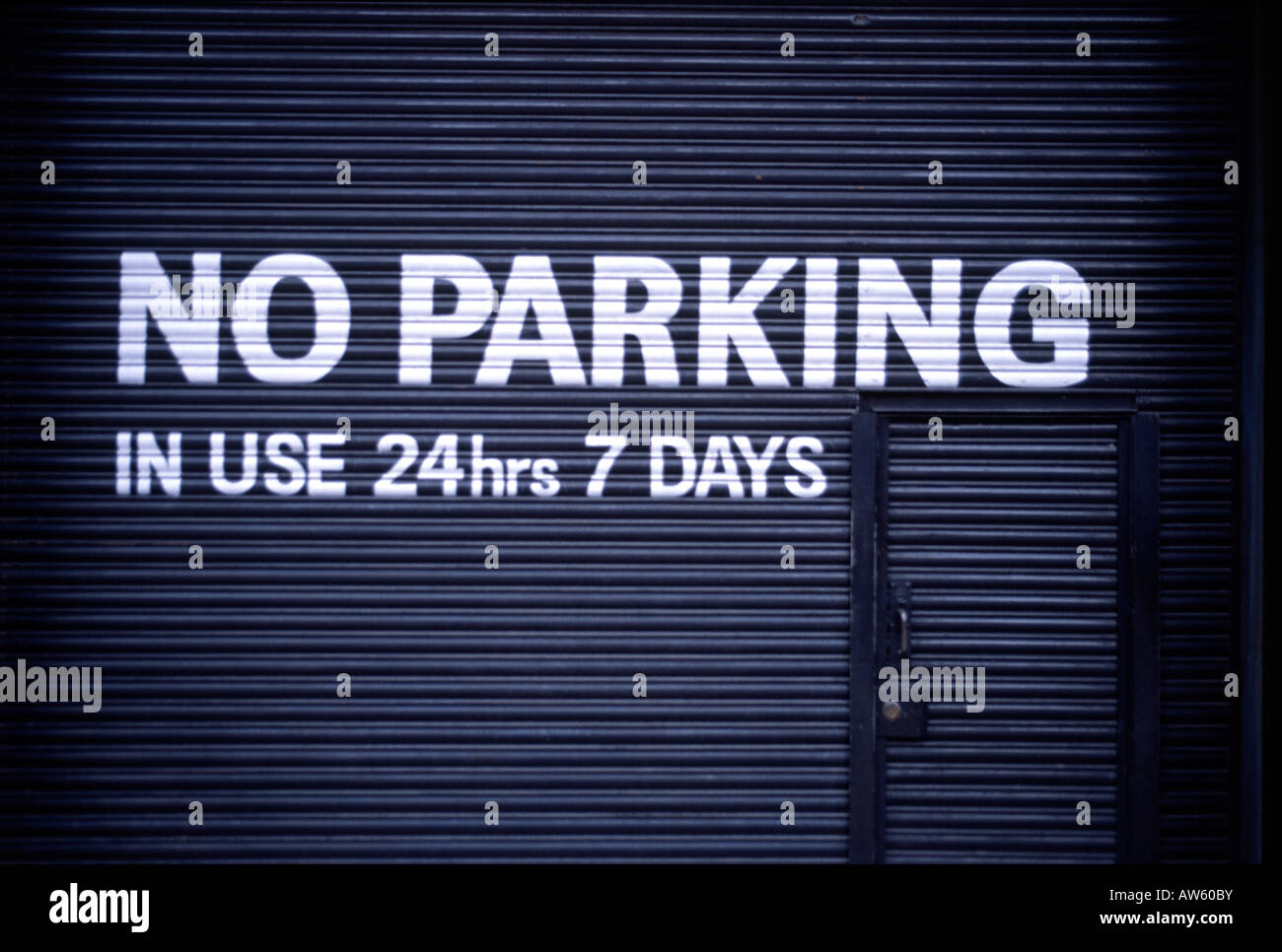 no parking sign on a garage door in the uk Stock Photo - Alamy