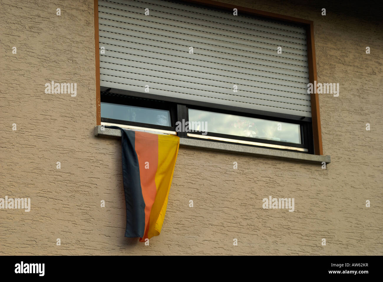 German flag hanging out of window Stock Photo - Alamy