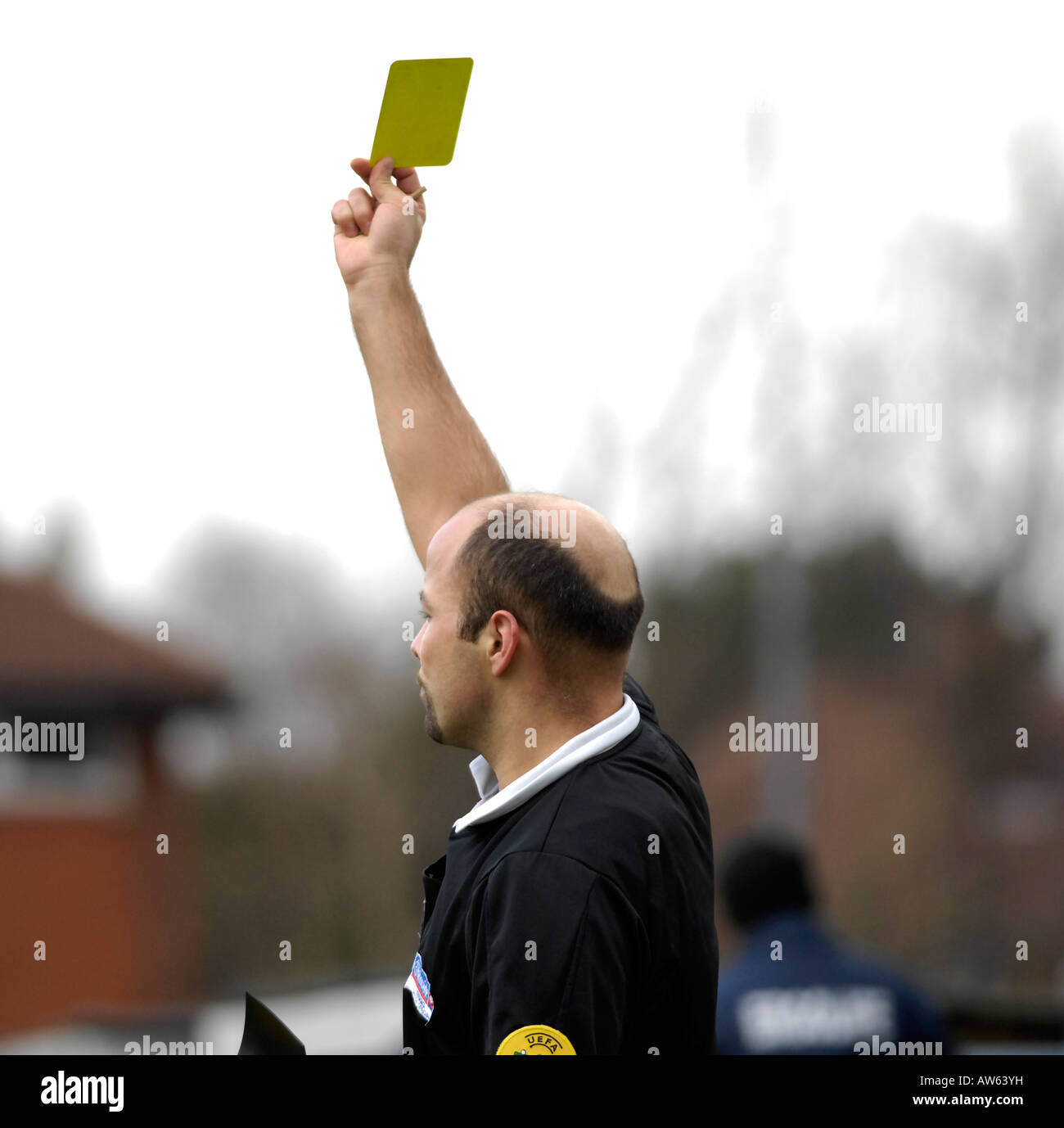 referee showing yellow card Stock Photo - Alamy