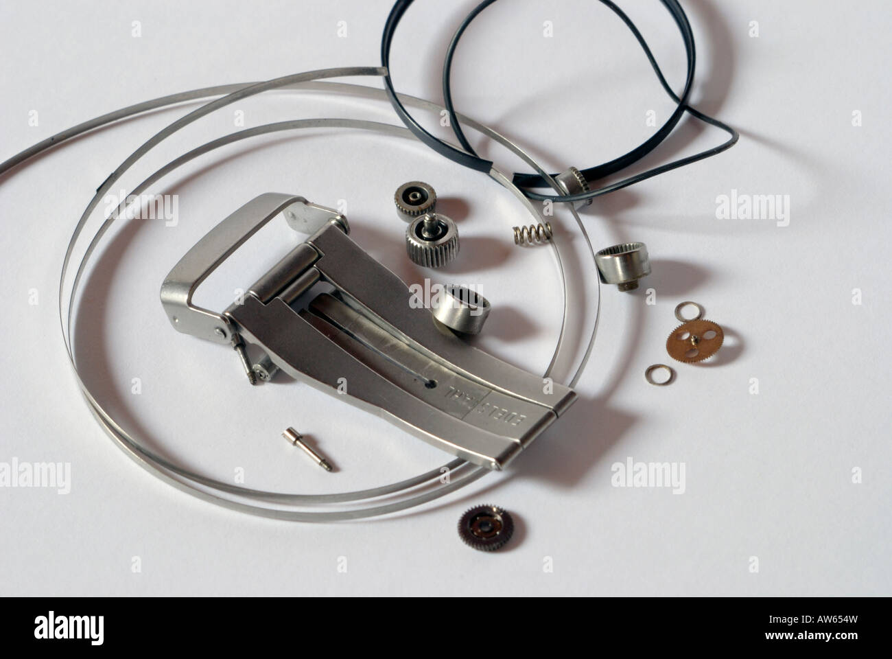 Parts of a mechanical clockwork taken out for repair Stock Photo - Alamy