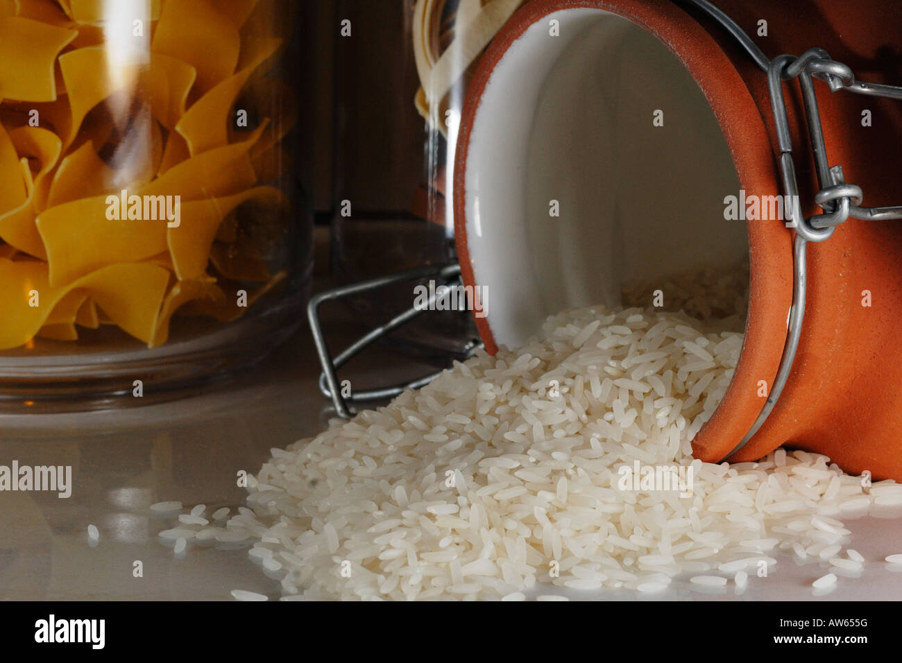 rice pouring out of a storage can Stock Photo - Alamy