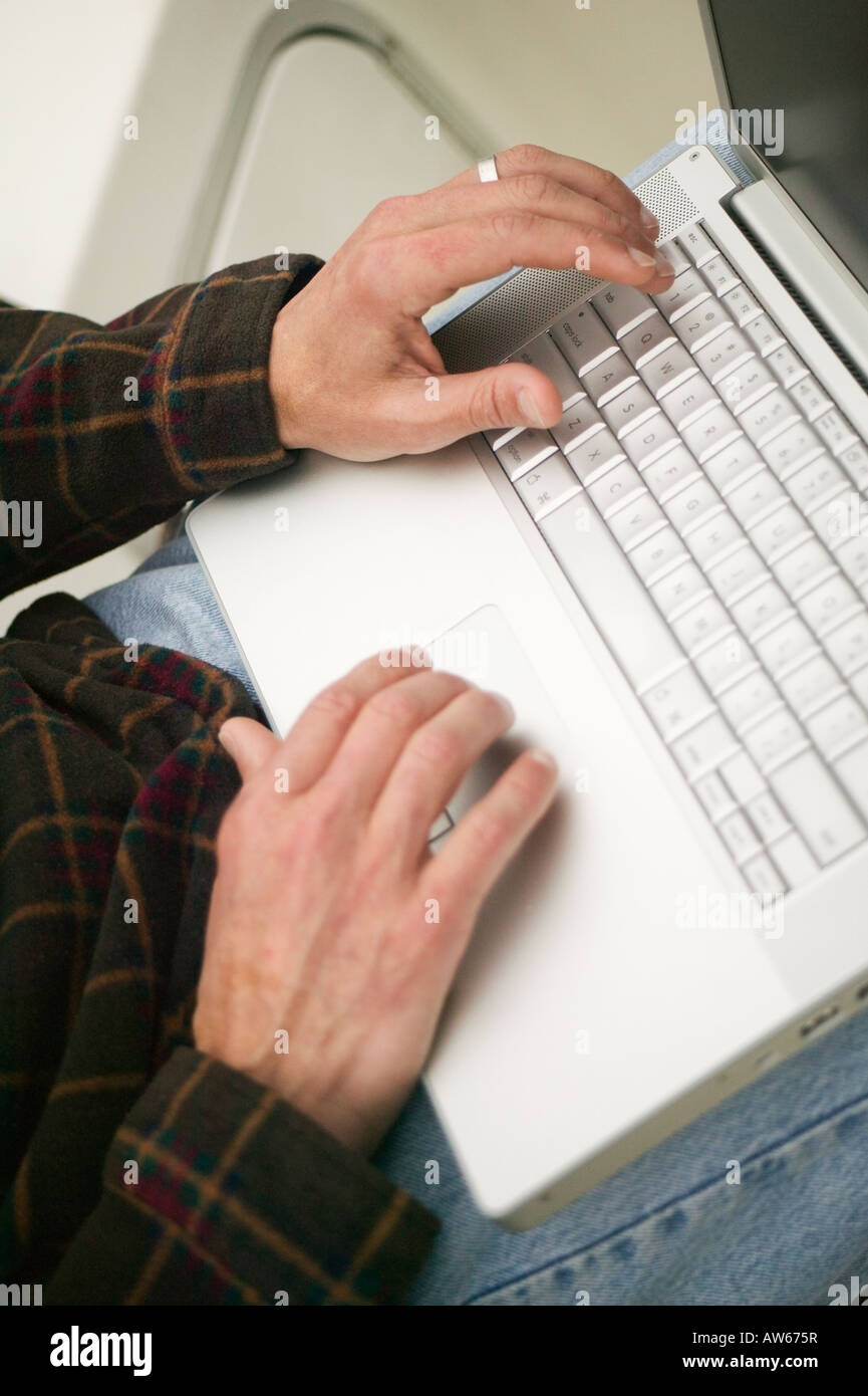 Mans hands on a computer laptop Stock Photo - Alamy