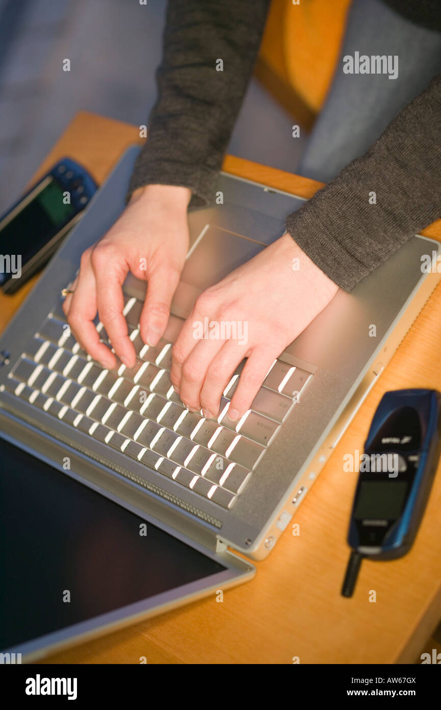 Mans hands on a computer laptop Stock Photo - Alamy