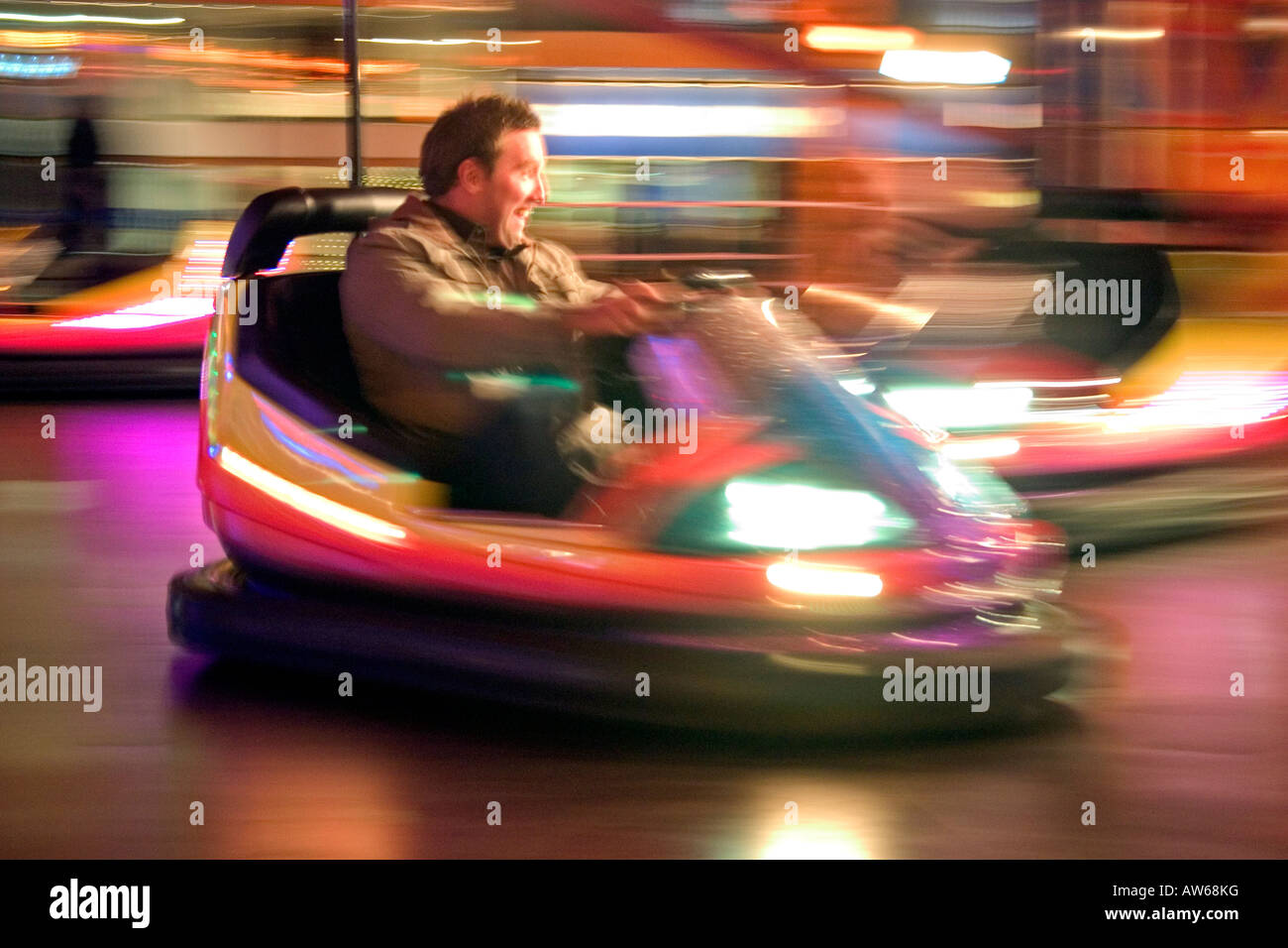 Night time bumper car ride at a fairground in Leicester Square Stock ...
