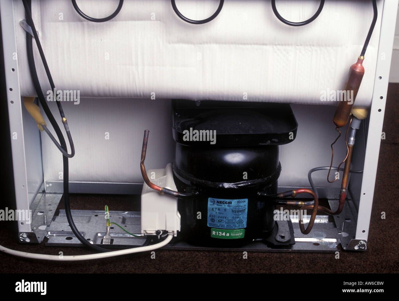 A compressor at the back of a refrigerator Stock Photo - Alamy