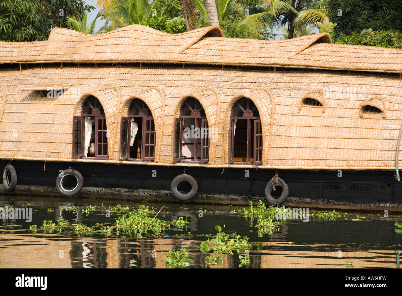 A Kettu Vallam houseboat on the river, Kuttanad Backwaters, near ...