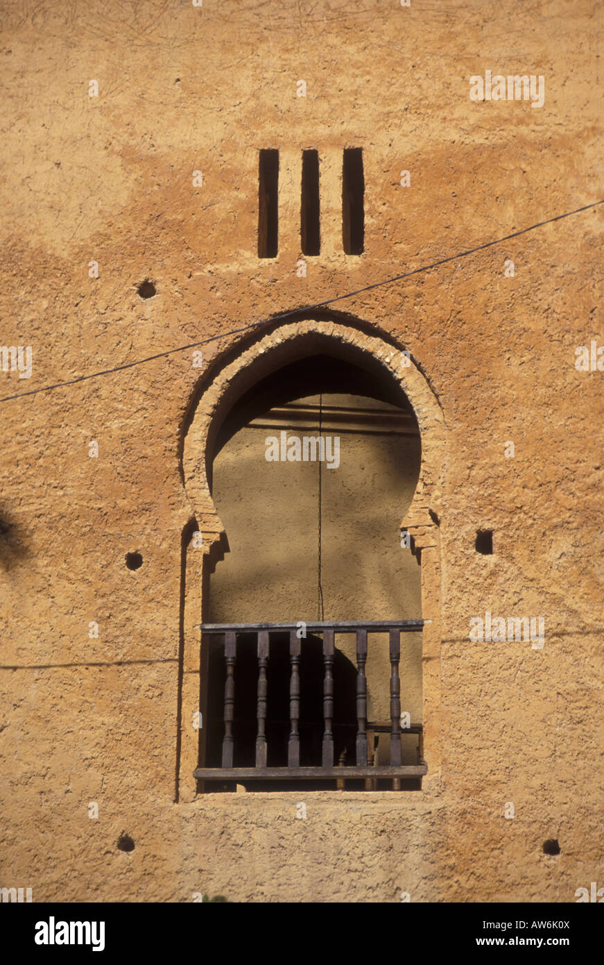 Arched window in a sand coloured wall Stock Photo - Alamy
