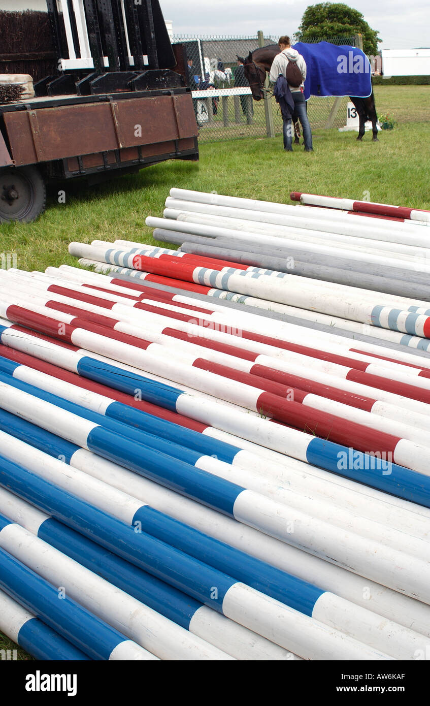 Equestrian fence poles with horse and rider in the background Stock ...