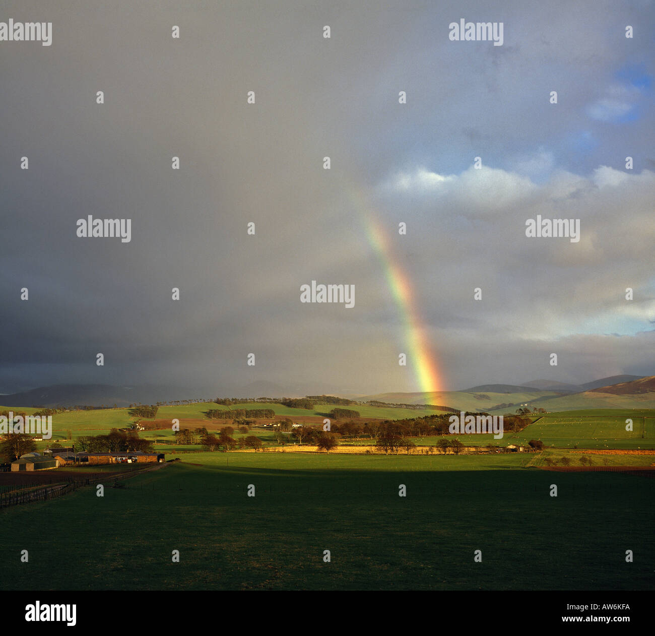 RAIN STORM AND RAINBOW OVER HILLS SCOTLAND UK Stock Photo - Alamy