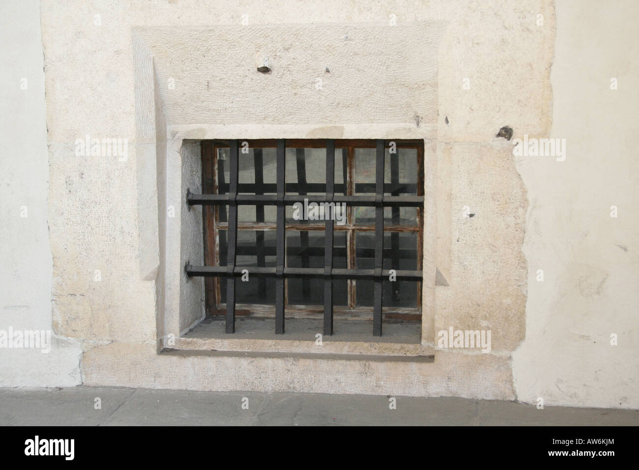 Cage on the window prison Stock Photo - Alamy