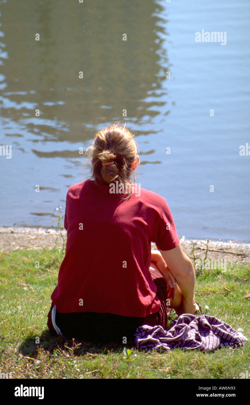 Woman age 21 sitting by the shores of Loring Pond. Ben and Jerry's One ...