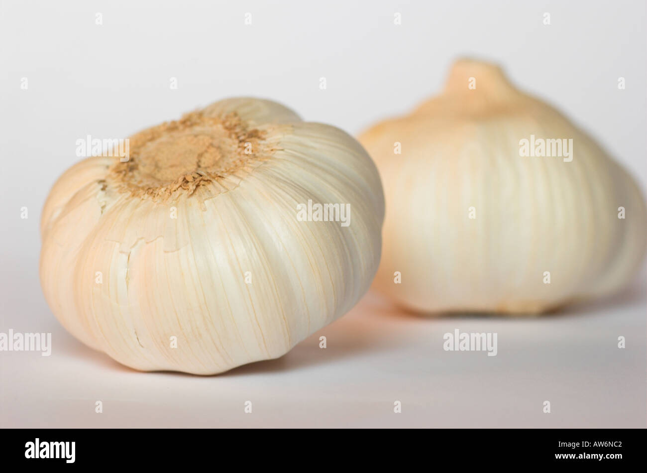 Two cloves of organic garlic close up Stock Photo - Alamy
