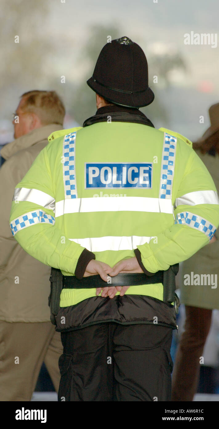 Policeman walking with his hands behind his back on duty Stock Photo ...