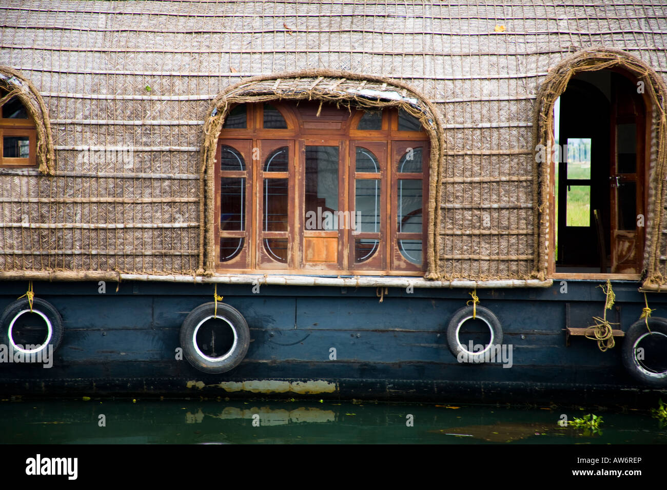A Kettu Vallam houseboat on the river, Kuttanad Backwaters, near ...