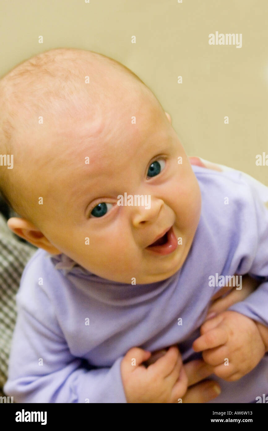 Bored, tired baby beginning to yawn Stock Photo - Alamy