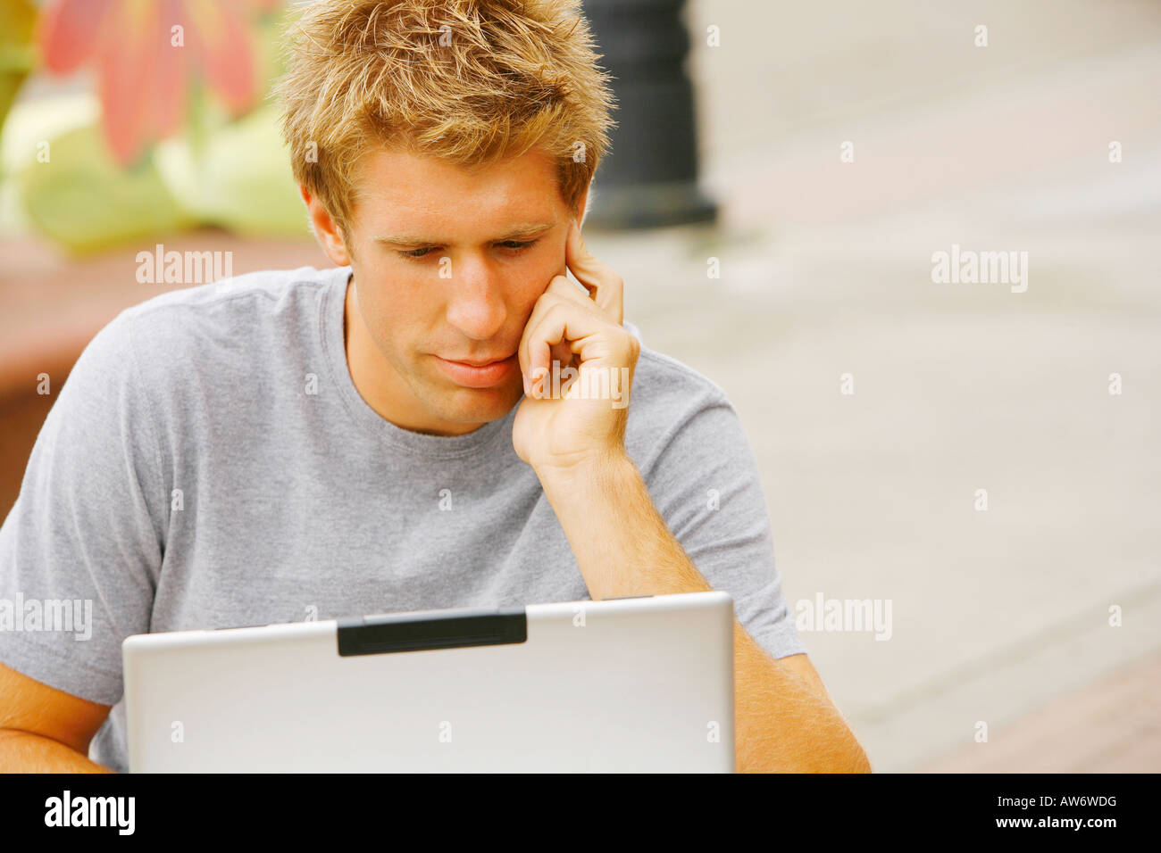 Man behind a laptop Stock Photo - Alamy