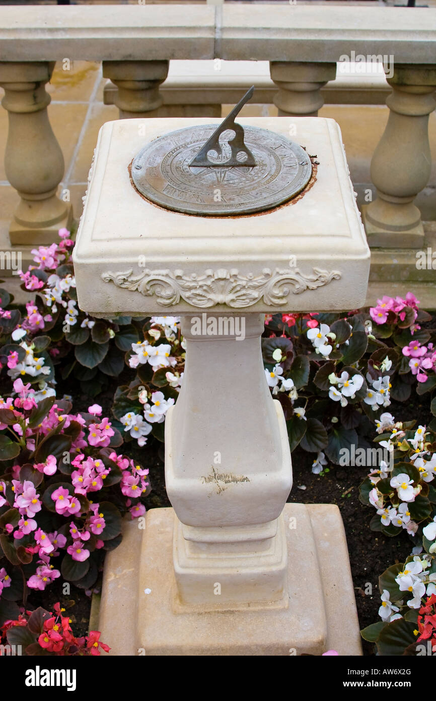 Stone sundial in English courtyard garden Stock Photo - Alamy