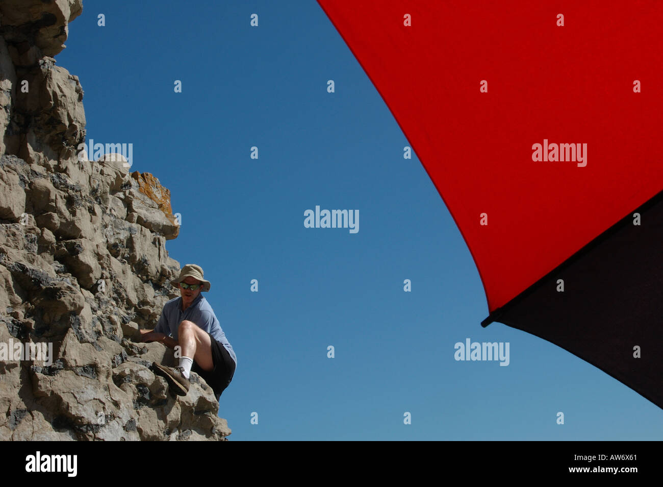 Man Clinging To Cliff High Resolution Stock Photography and Images - Alamy