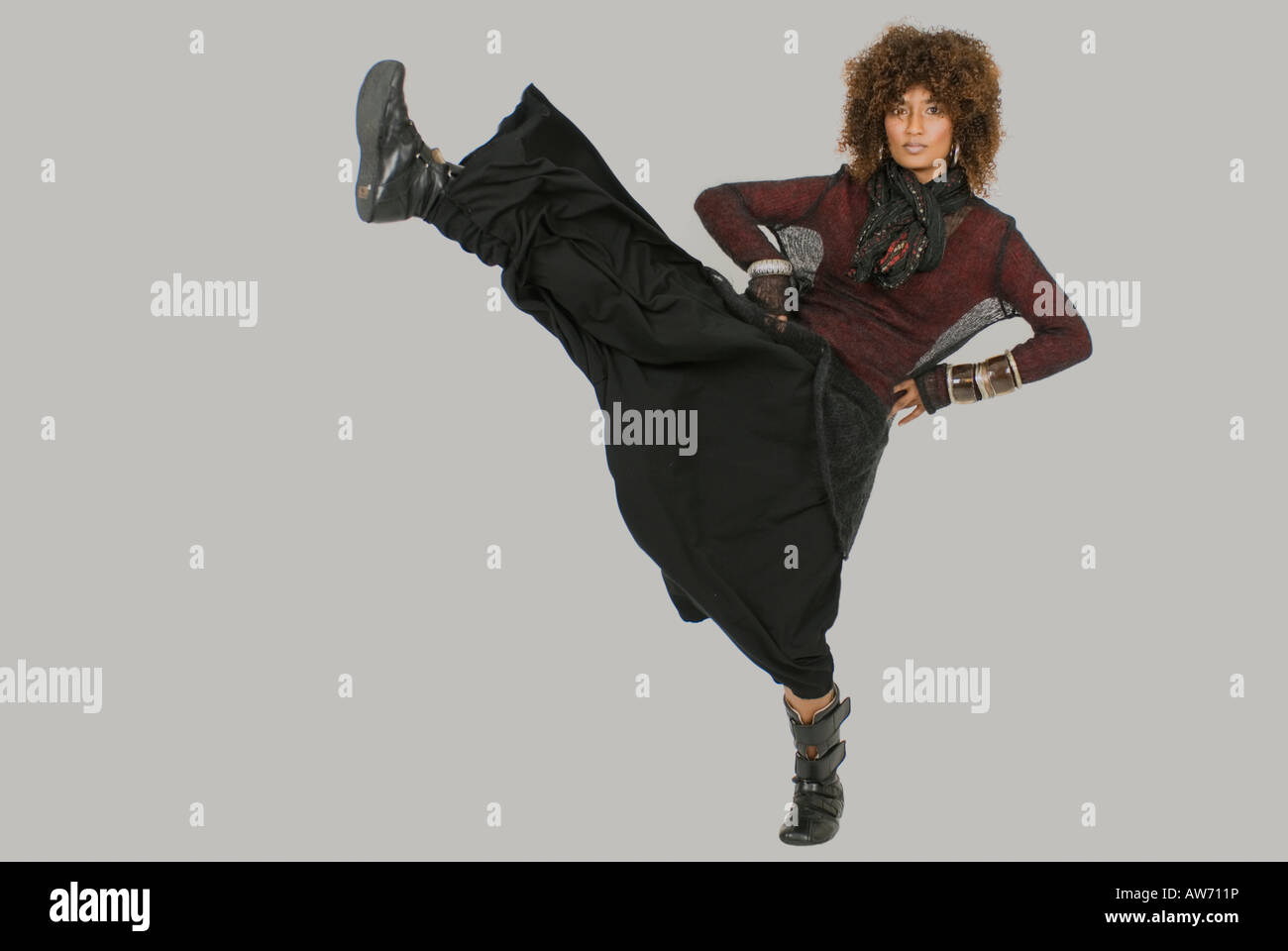 Woman kicking leg up hi-res stock photography and images - Alamy