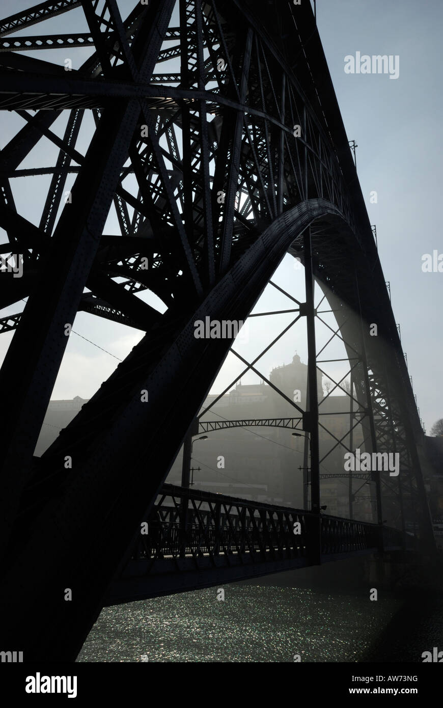 Early morning light filters through the Maria Pia bridge over the Duero ...