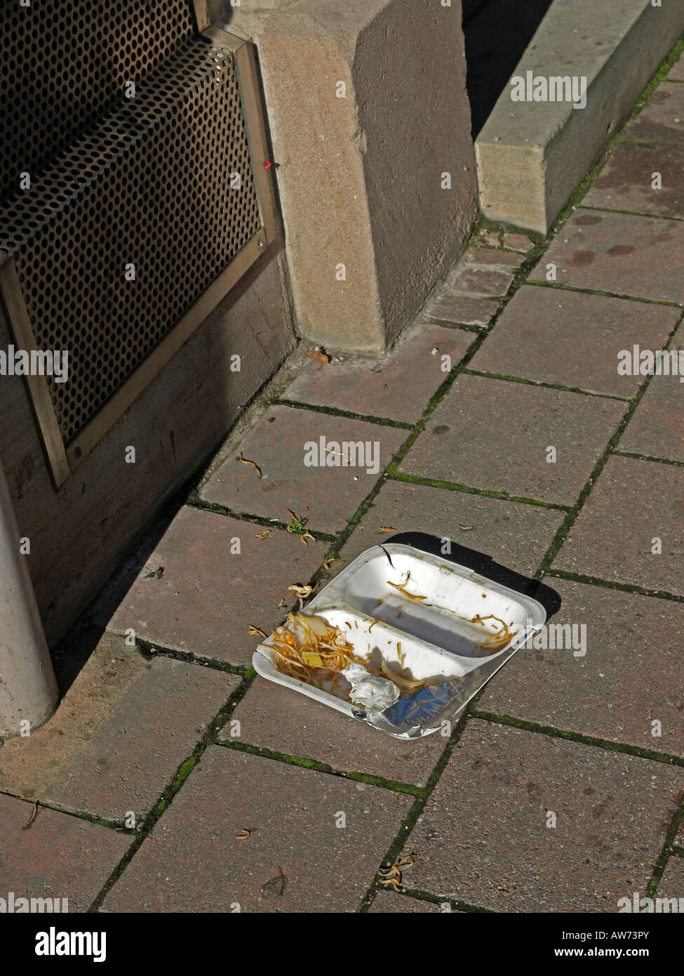 waste rubbish from takeaway restaurant snack bar on pavement in town ...