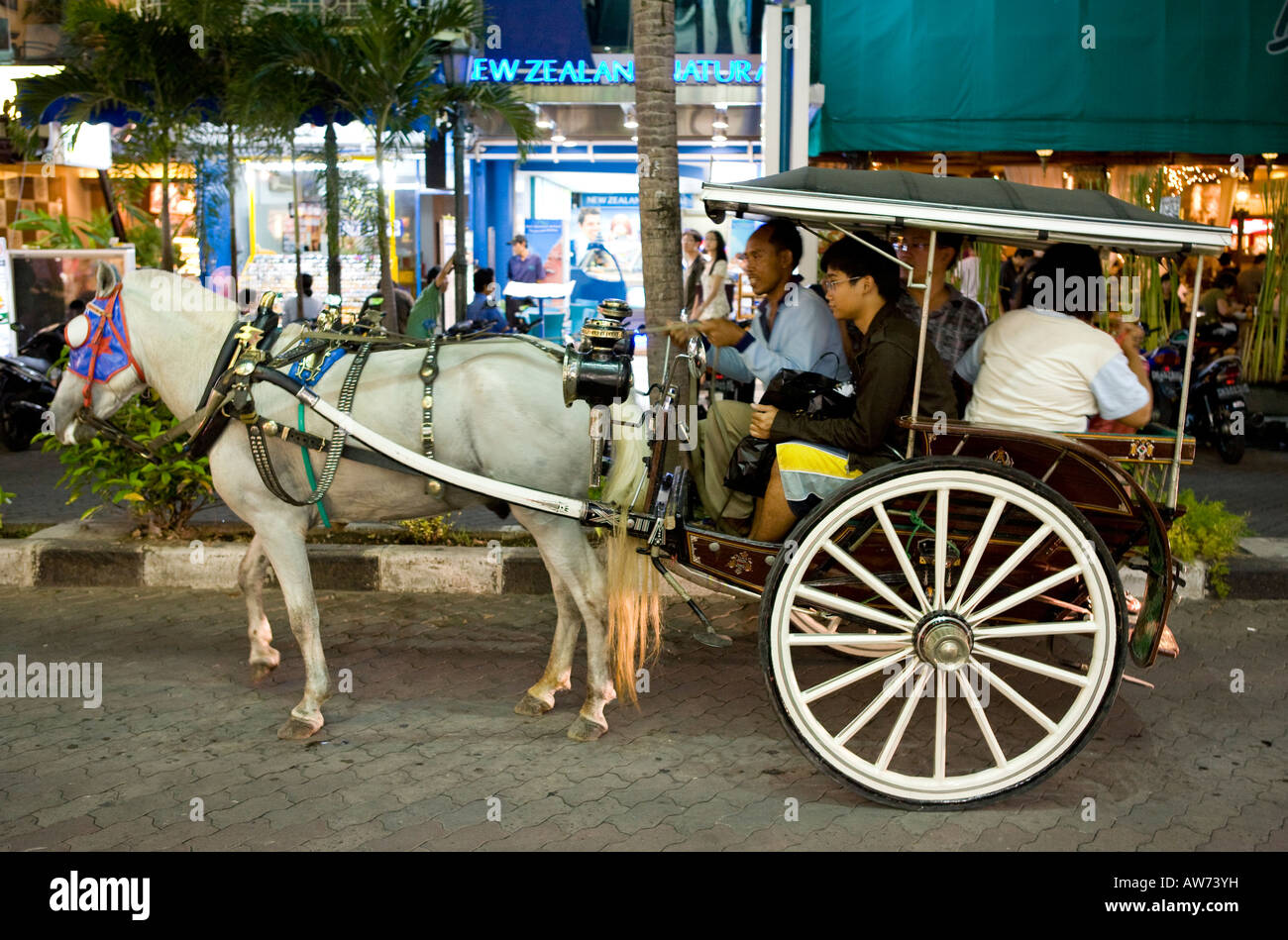 Pony And Trap Nightime in Downtown Kuta Bali Indonesia Stock Photo - Alamy