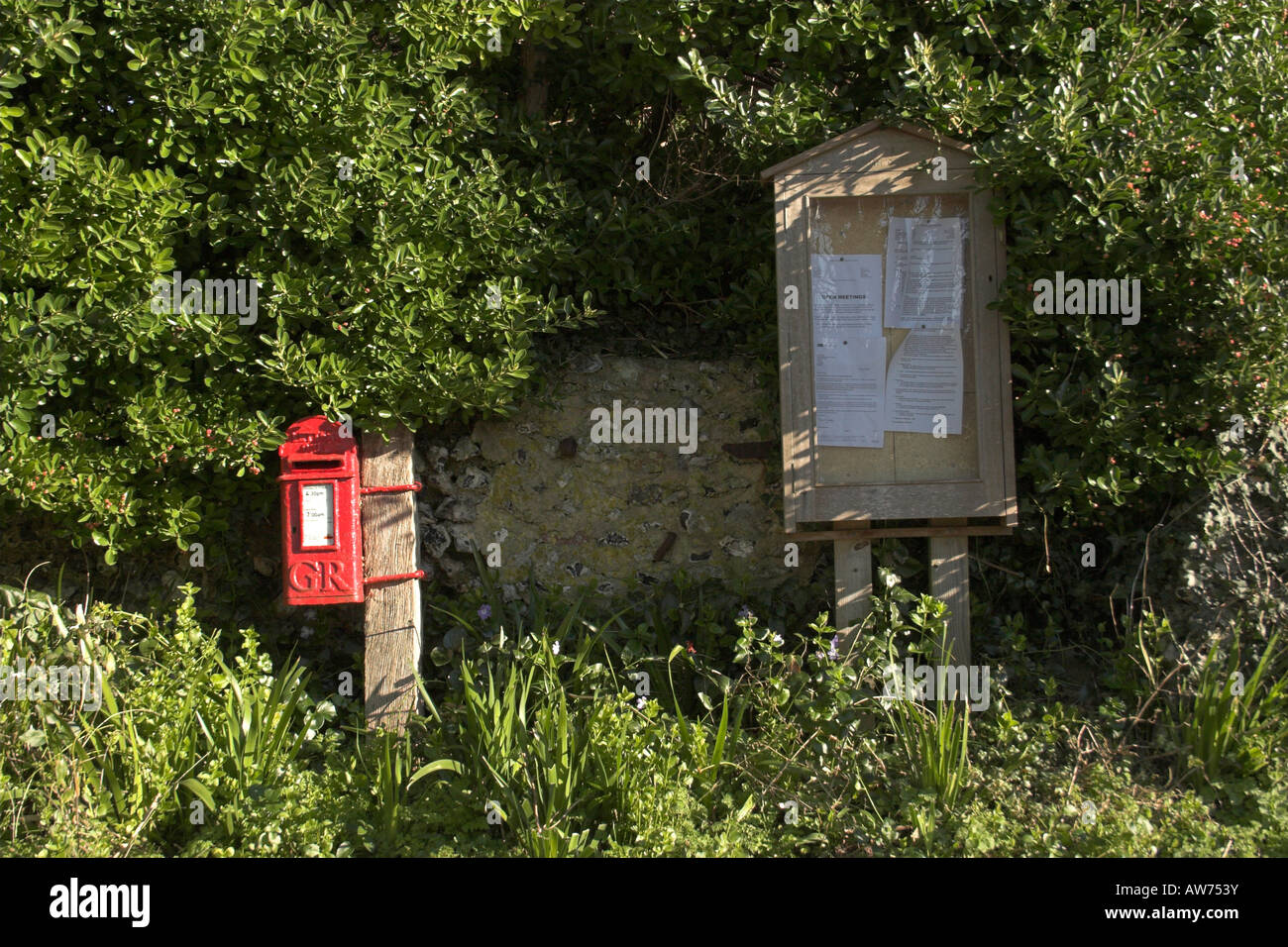 A village GR (George V) post box and village notice board - Bishopstone ...