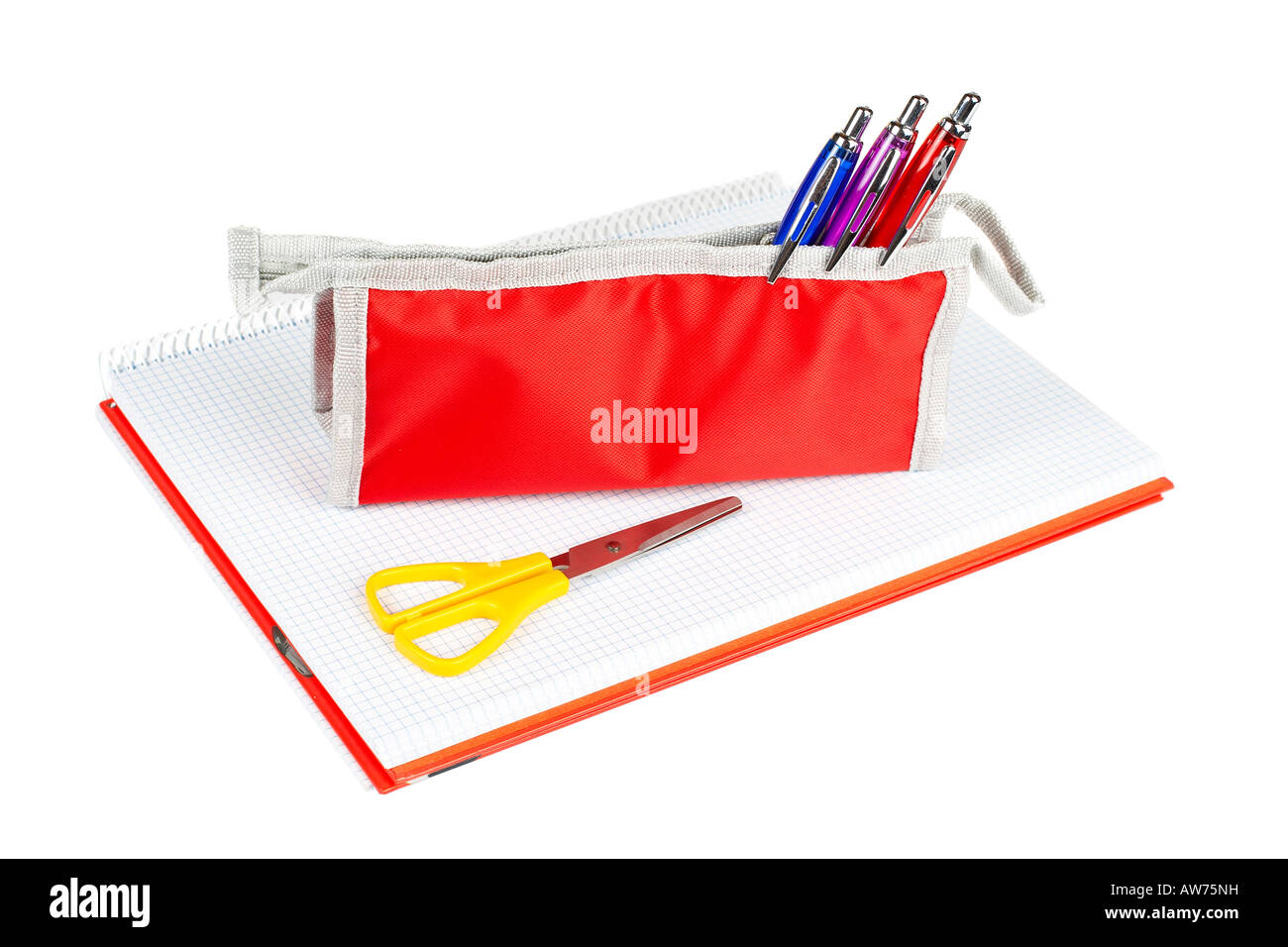 A red pencil case and yellow scissors over a notebook Stock Photo - Alamy