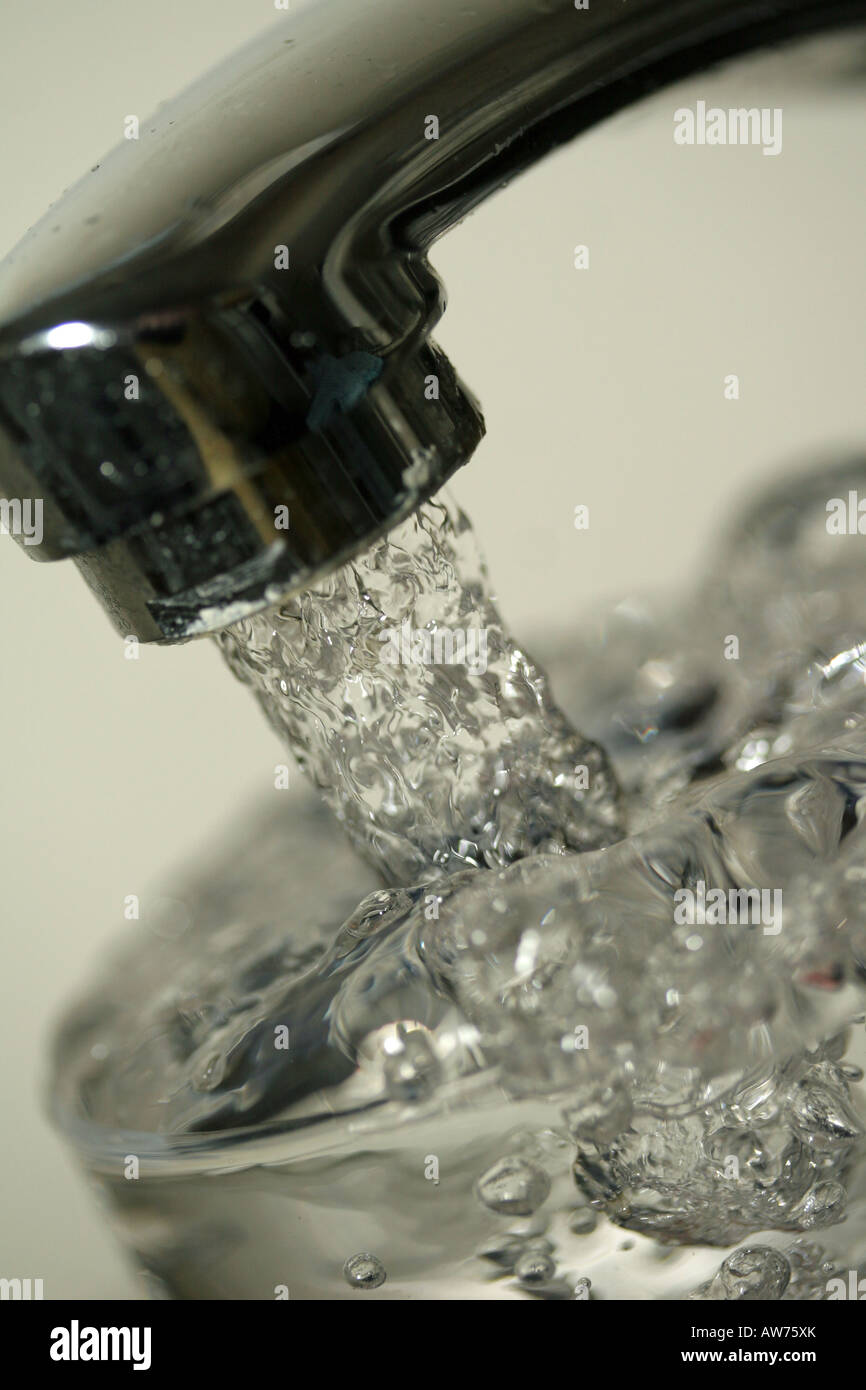 filling a glass with tap water Stock Photo - Alamy