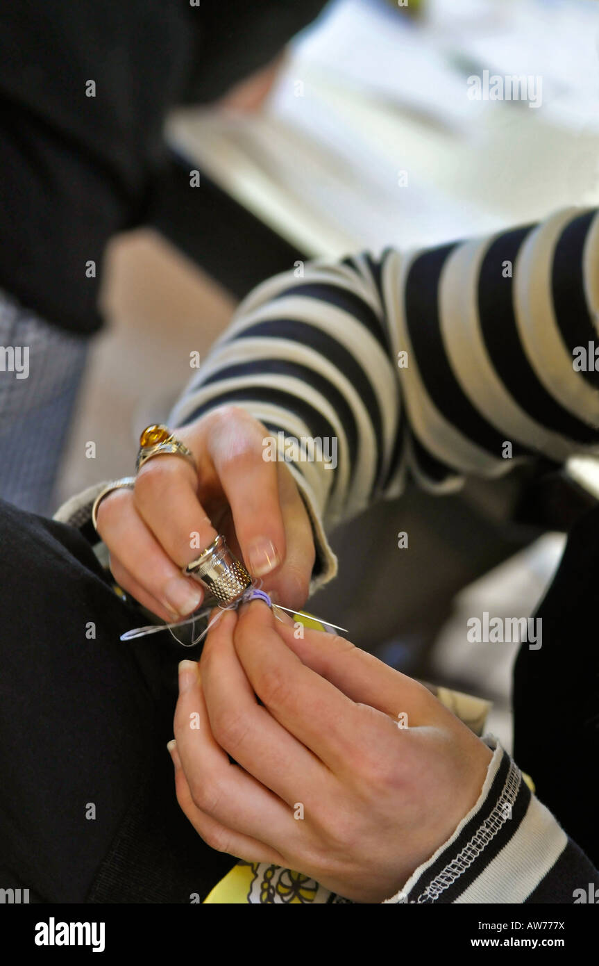 Sewing by hand Stock Photo - Alamy