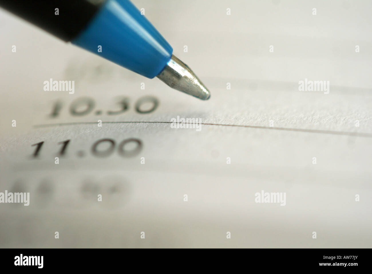 Pen writing in a diary Stock Photo - Alamy