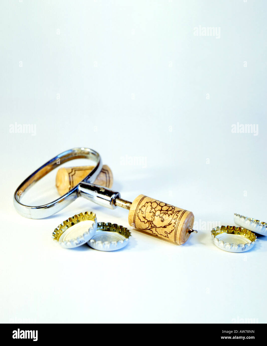 Corksrew and bottle tops Stock Photo - Alamy