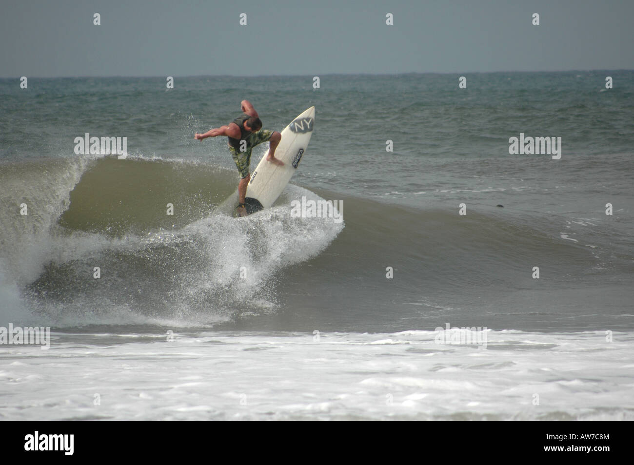 Person surfing in Hawaii Stock Photo - Alamy