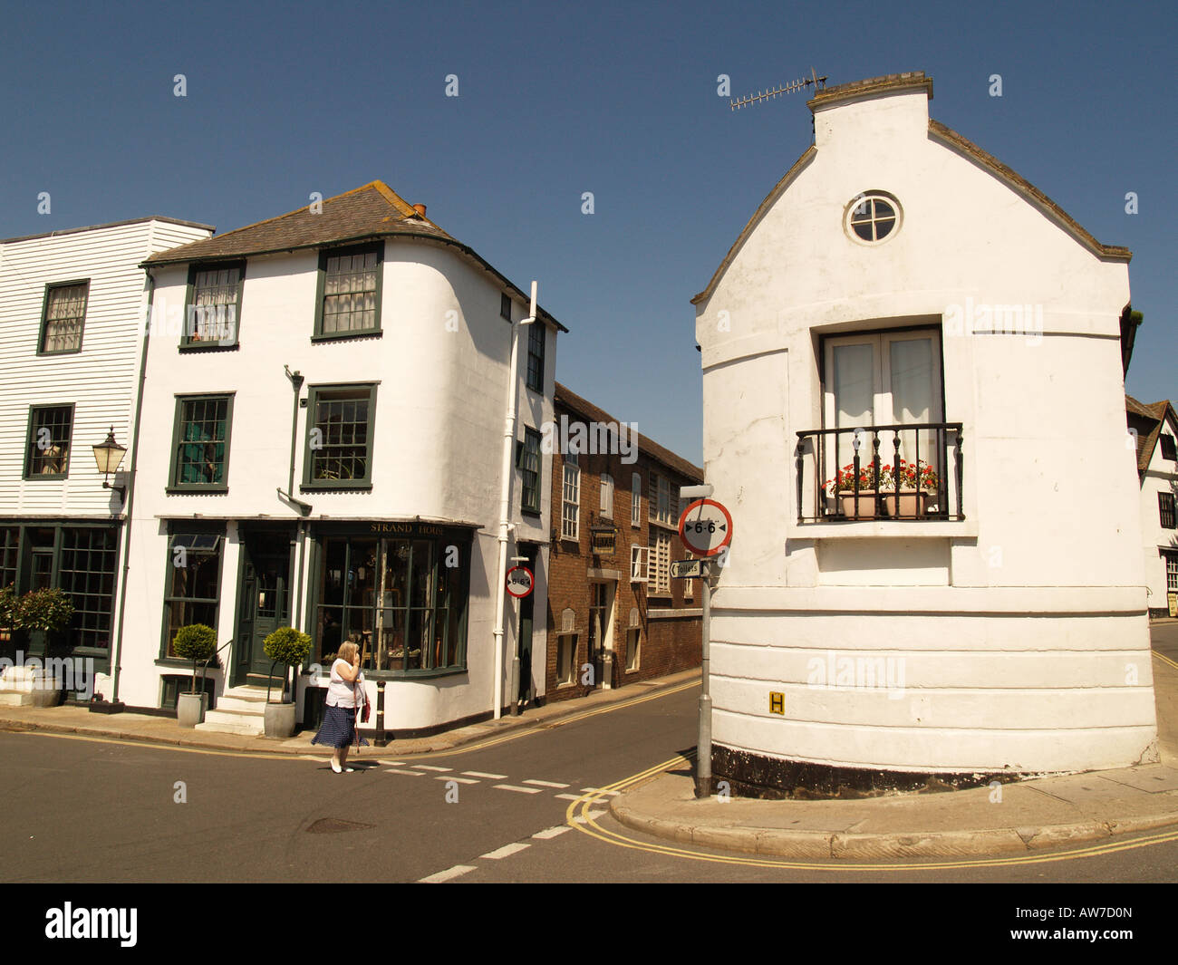 white 3 storey shops corner house building pillar Stock Photo - Alamy