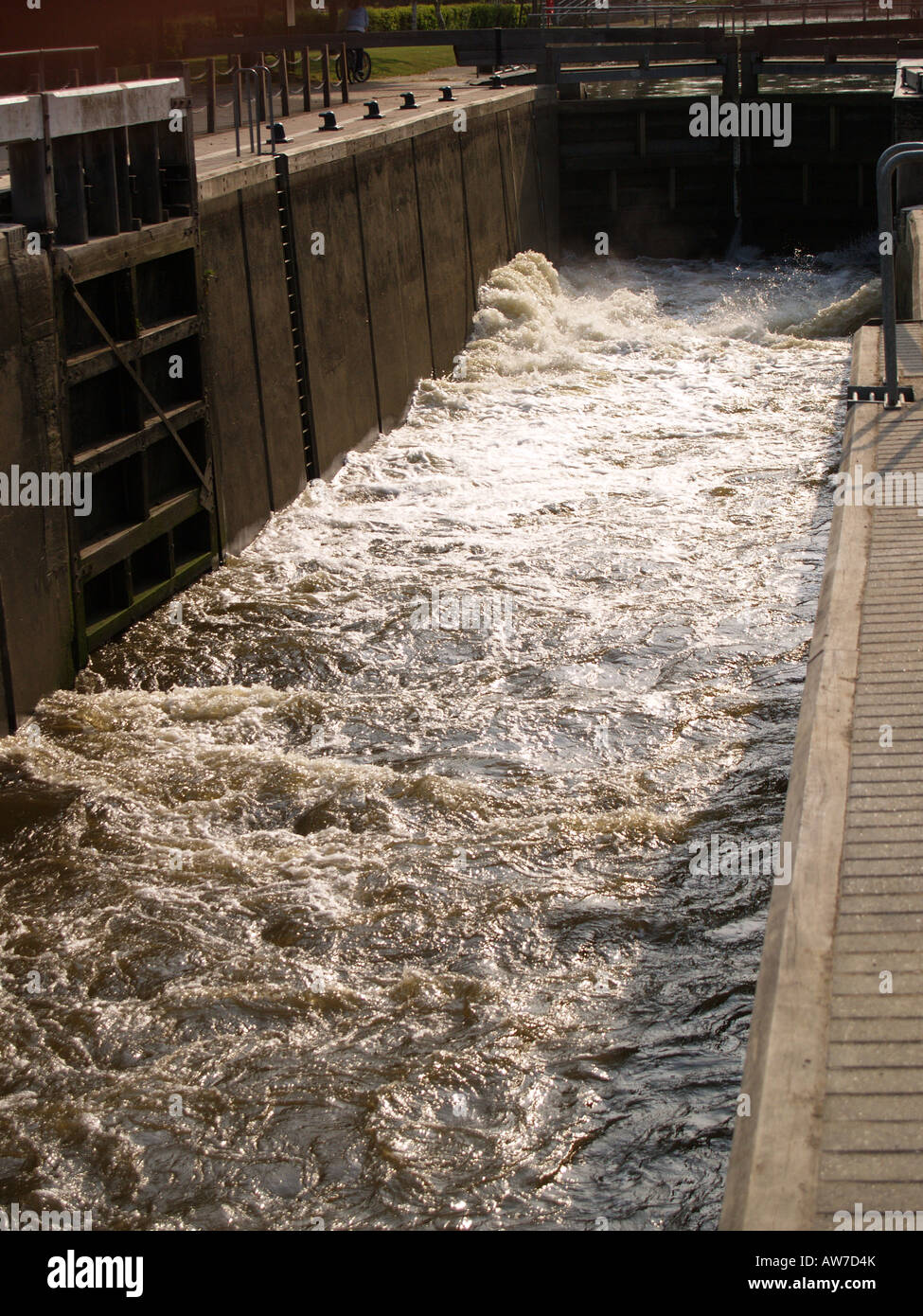 lock filling splash foaming water waves trapped Stock Photo - Alamy