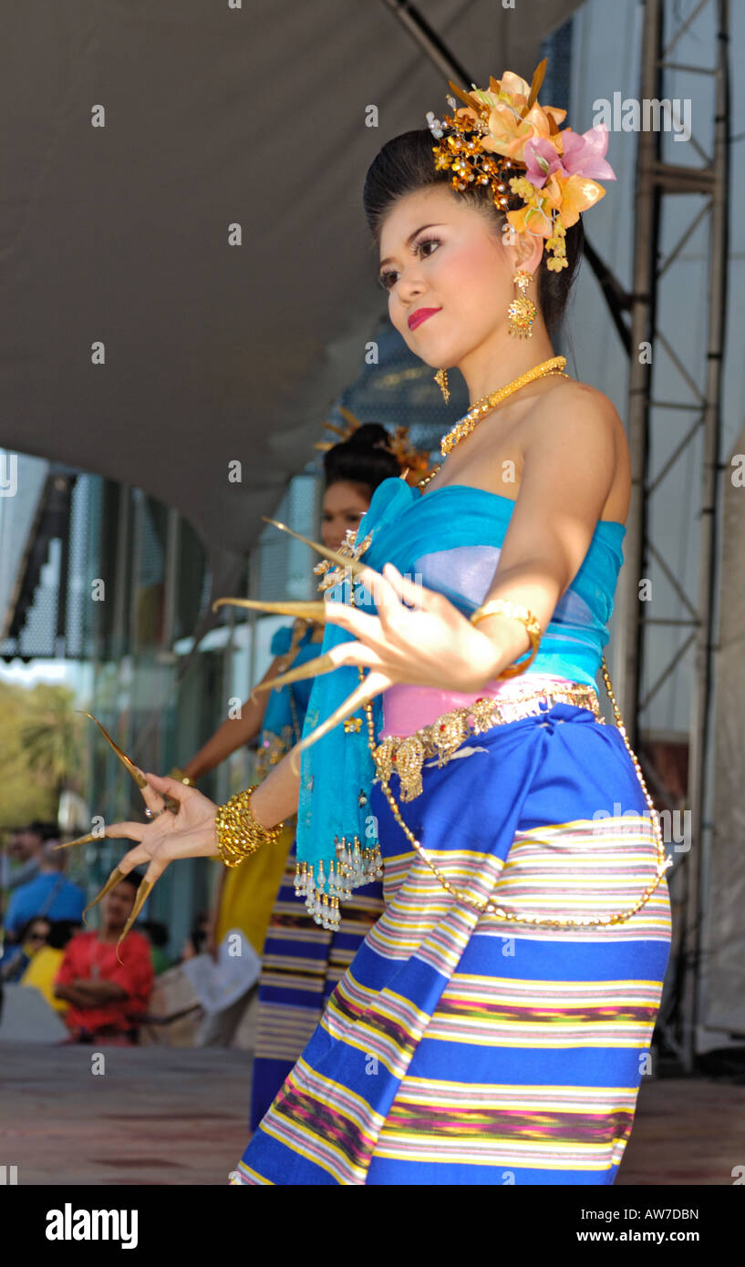 A traditional Thai female performer dancing during a cultural Thai ...