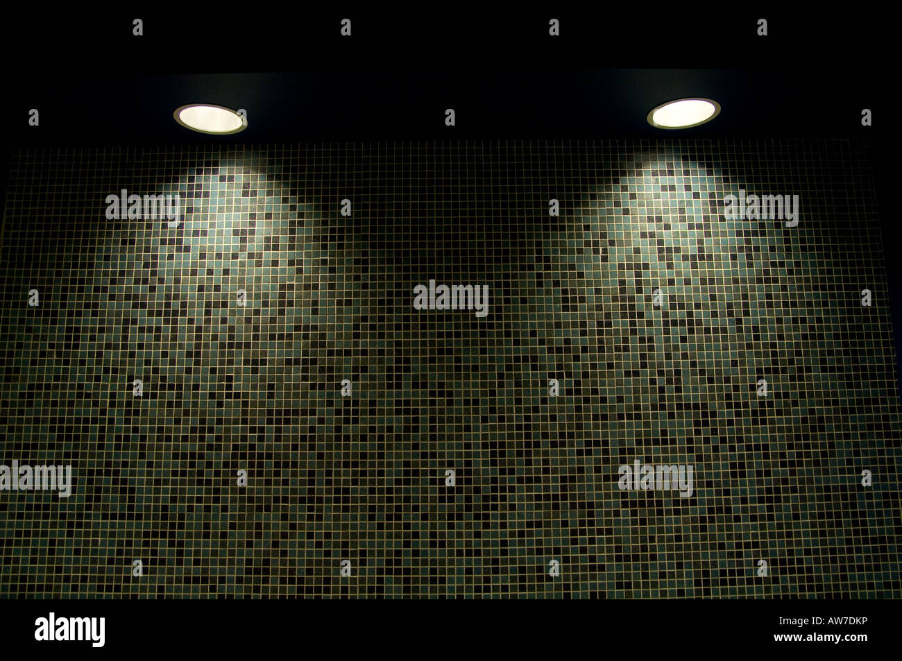 Pot-lights shining down on a tiled wall Stock Photo - Alamy