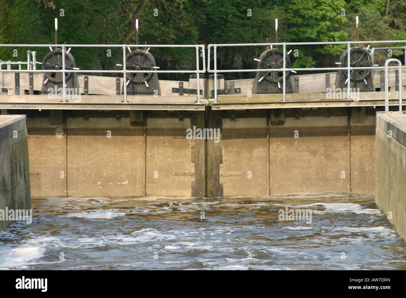 river water waves flowing filling lock gates rail Stock Photo - Alamy