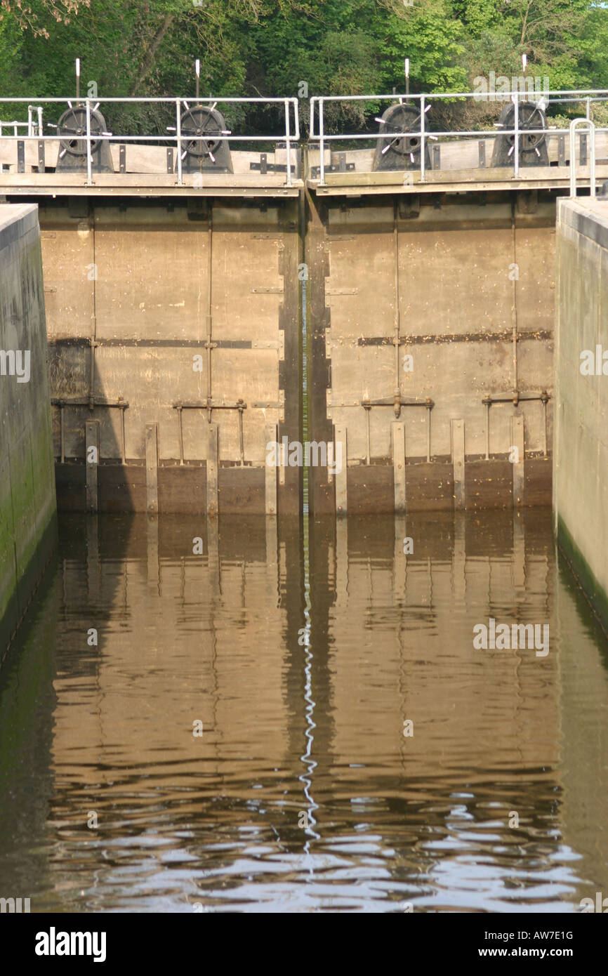 river water waves flowing filling lock gates rail Stock Photo - Alamy