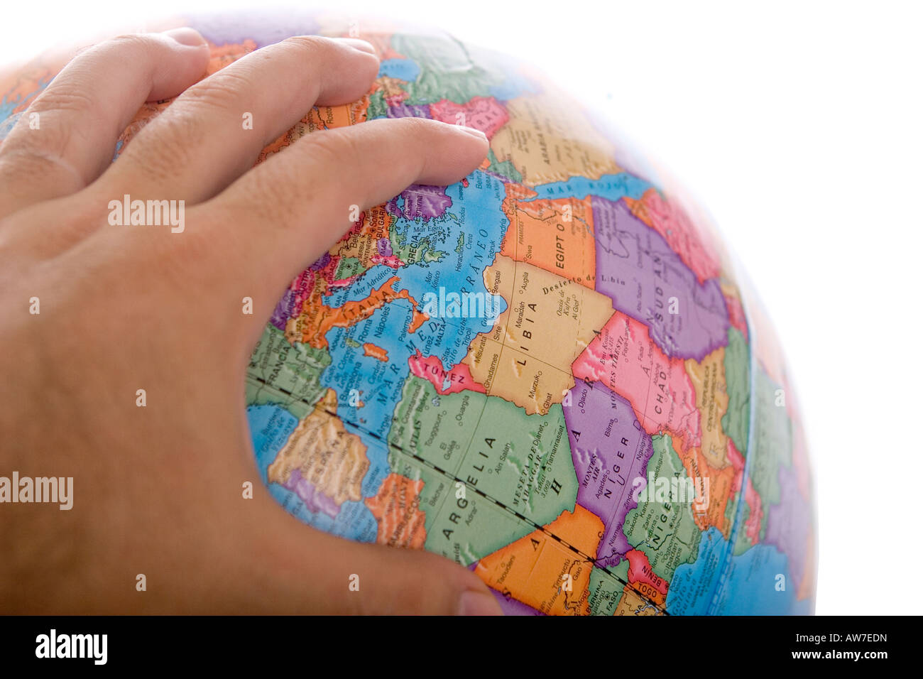 A hand over Europe in a world map globe Stock Photo - Alamy
