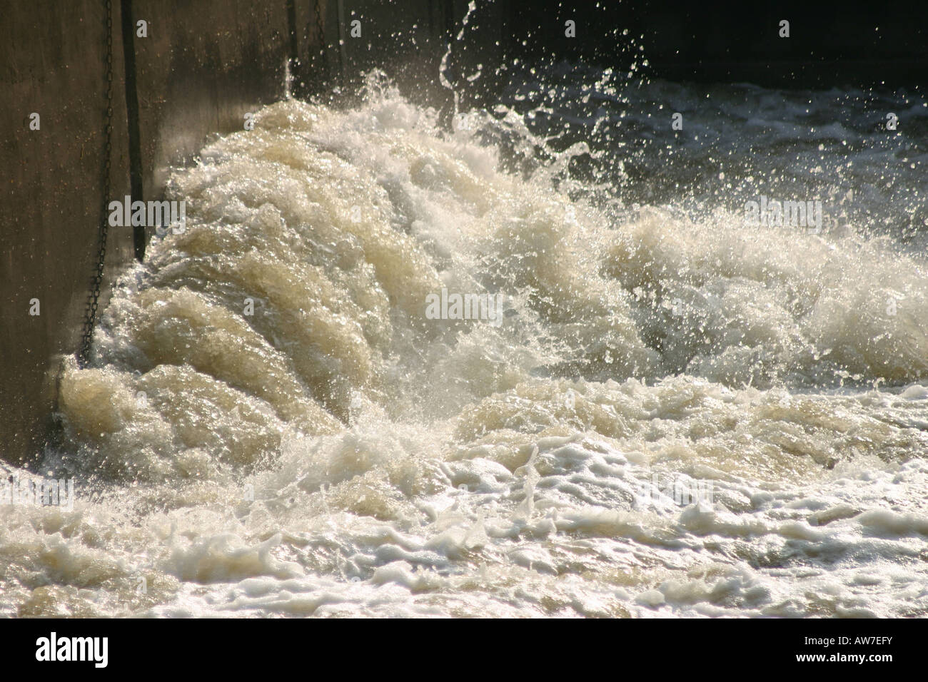 crashing river water waves flowing filling lock Stock Photo - Alamy