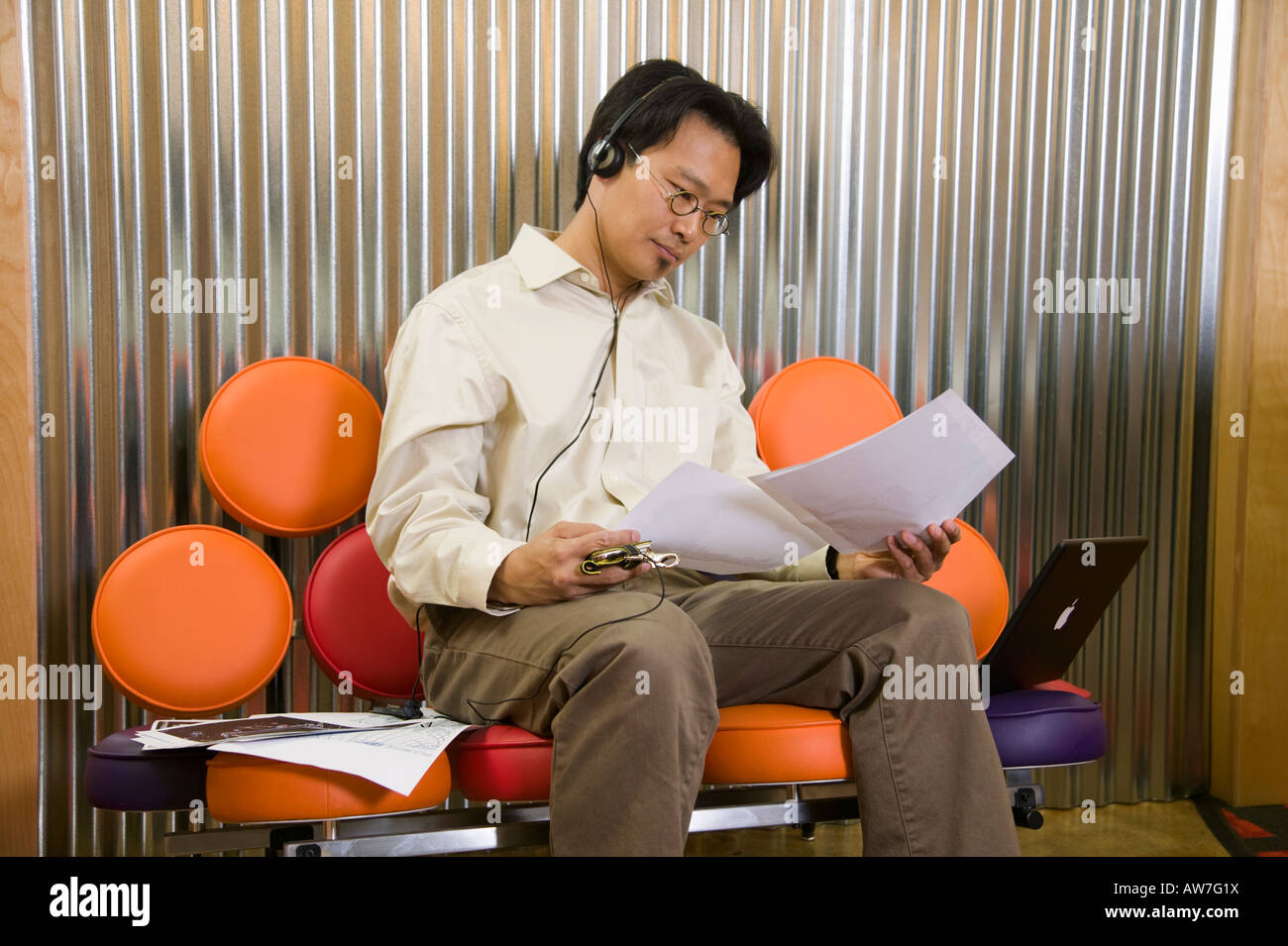 Man going over drawings in a modern office Stock Photo - Alamy