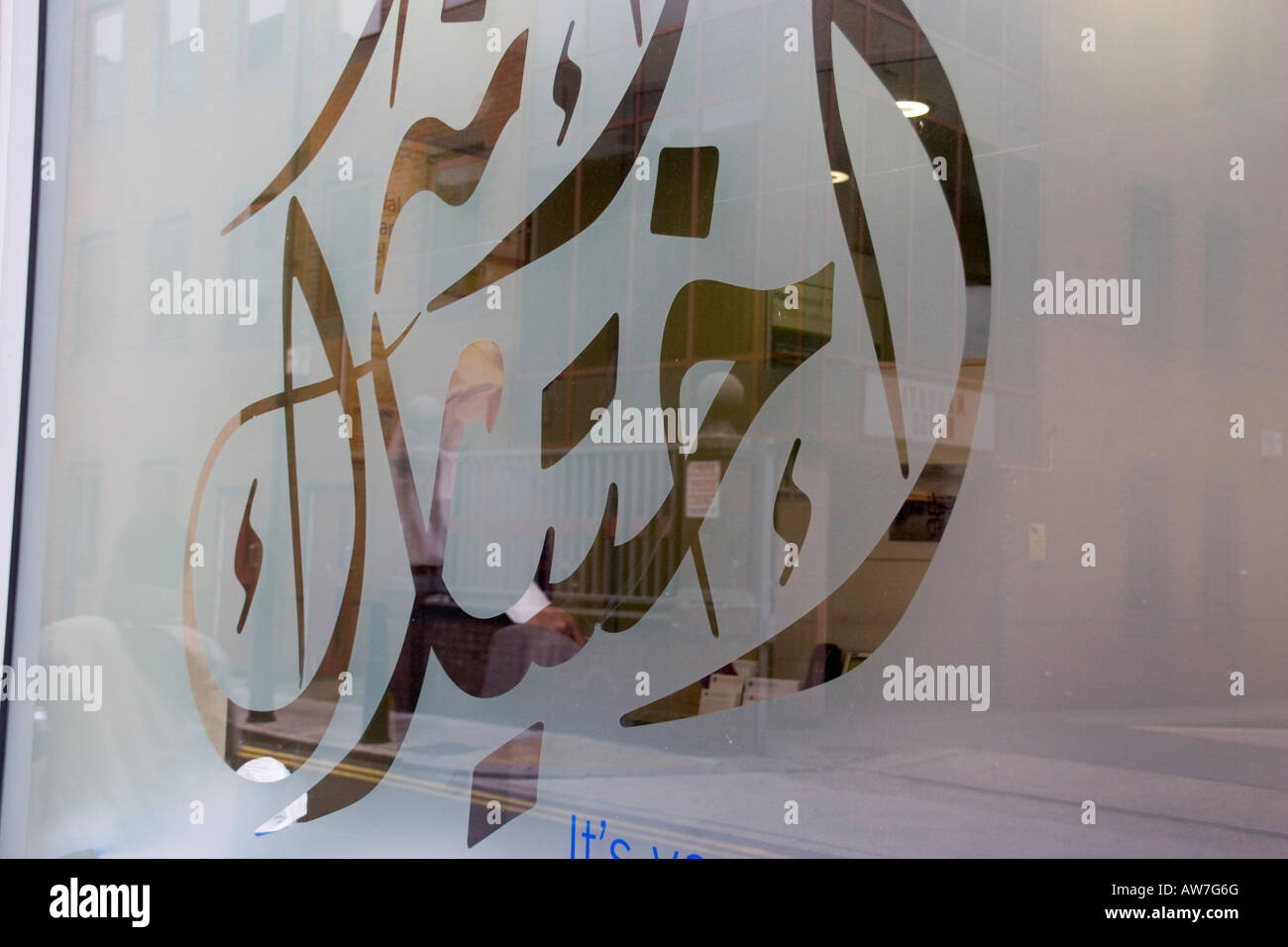 Arabic etched in shop window in Whitechapel east London England 2007 ...