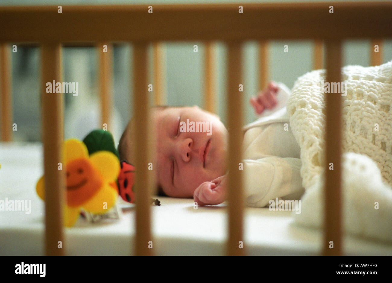sleeping baby in cot day light peace Stock Photo - Alamy